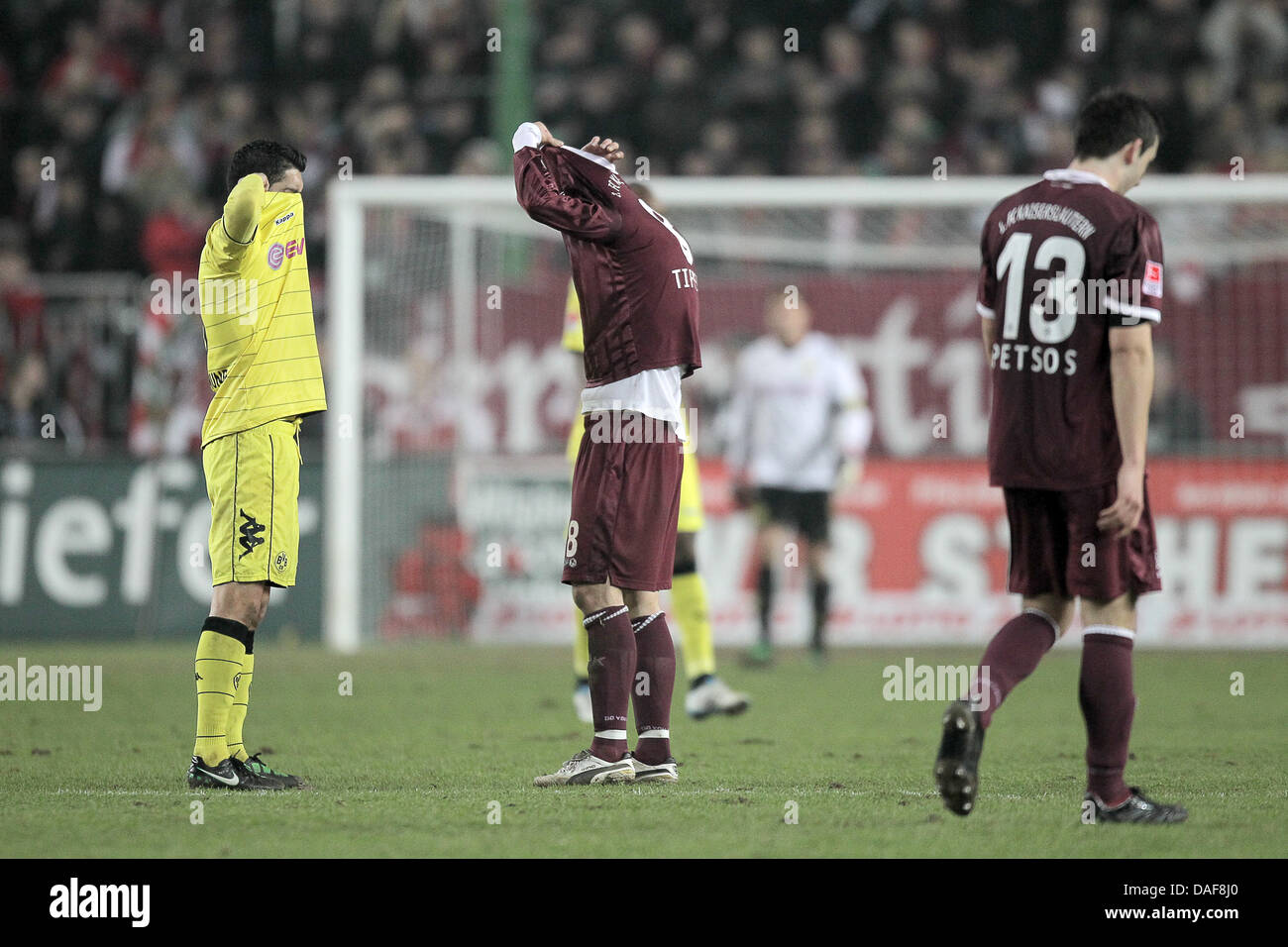Kaiserslautern's Christian Tiffert (C) and Dortmund's Nuri Sahin (L ...