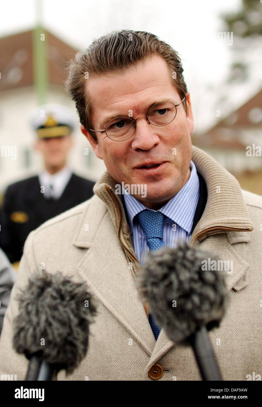 German Defence Minister Karl-Theodor zu Guttenberg (C) gives interviews ...