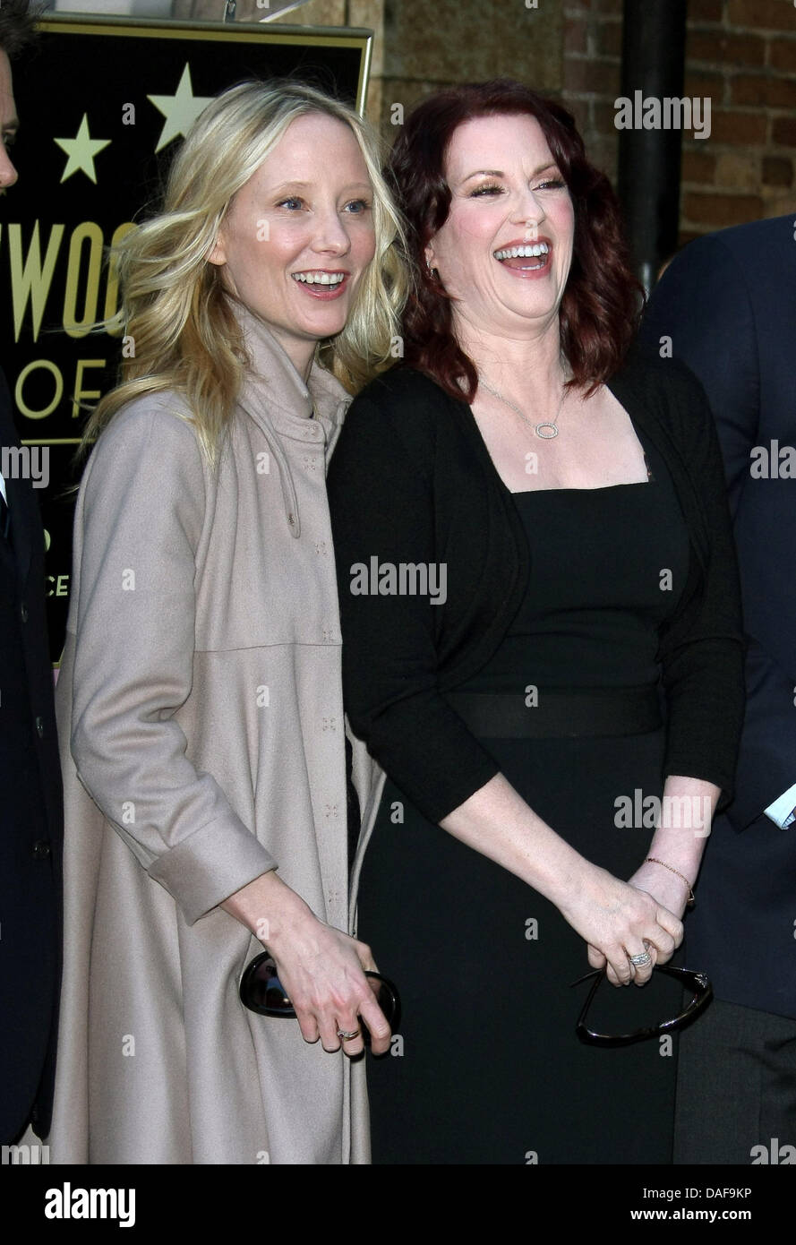 US actresses Anne Heche (L) and Megan Mullally (R) attend the ceremony ...