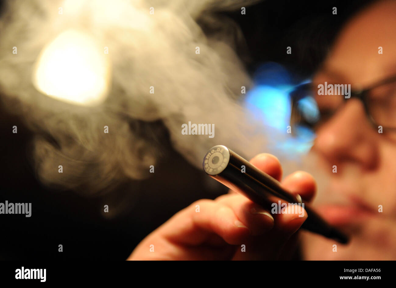 A woman smokes an electrical cigarette in Hamburg, Germany, 26 January ...