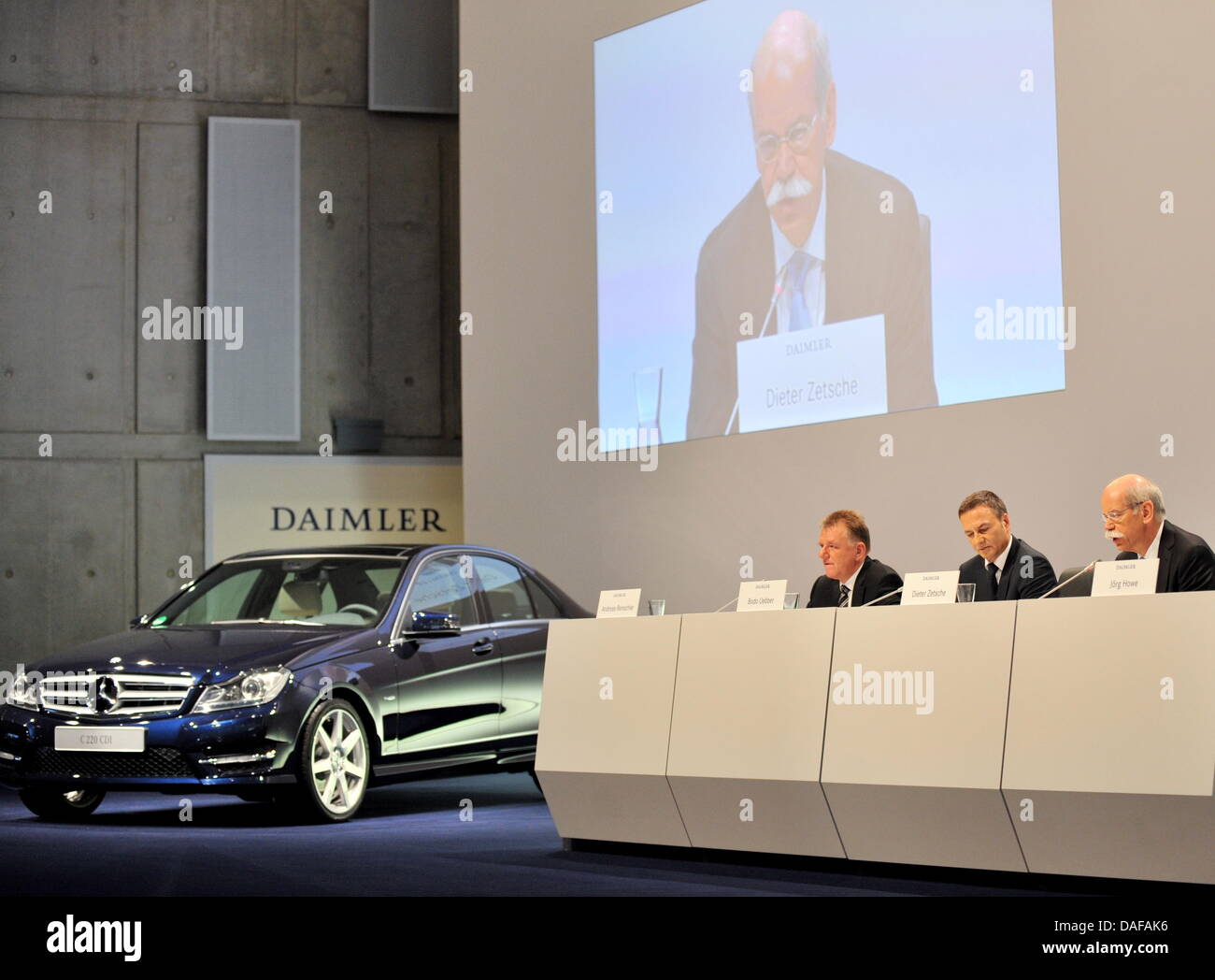 Dieter Zetsche (R), chairman of the car company Daimler, chief ...
