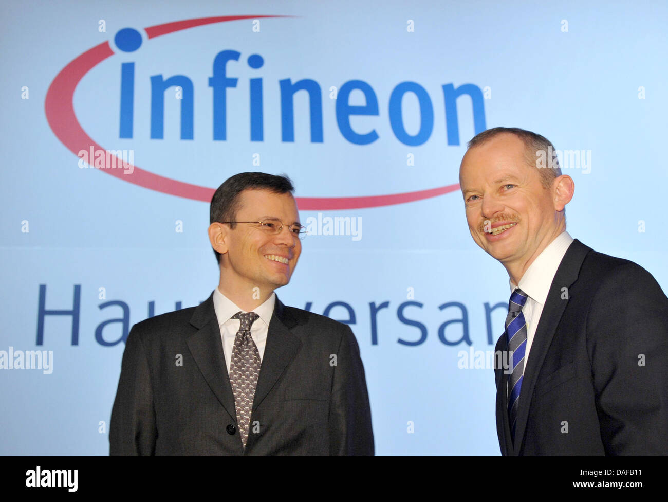 New chief financial officer of Infineon Dominik Asam (L) and chairman ...