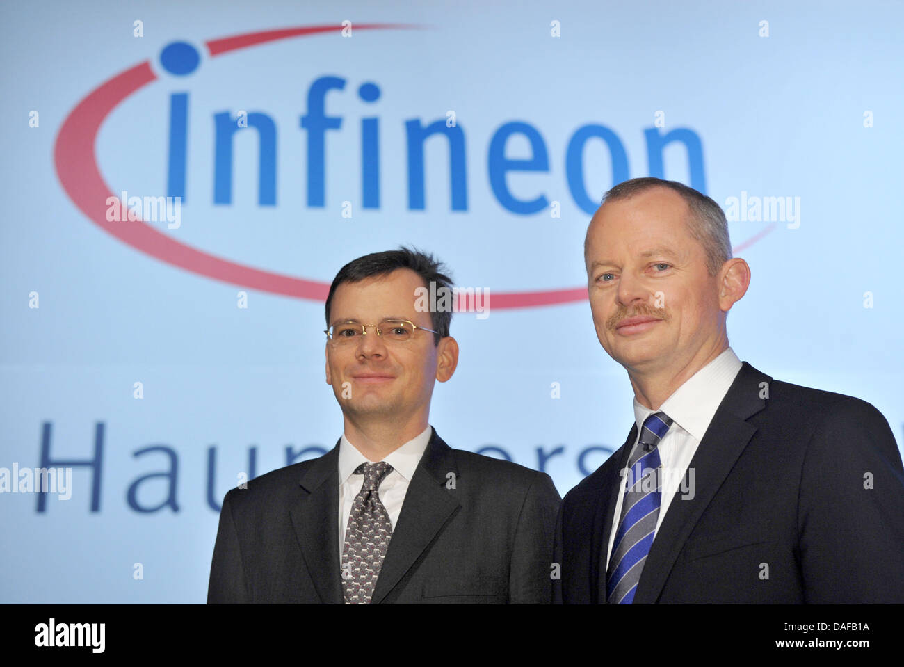 New chief financial officer of Infineon Dominik Asam (L) and chairman ...