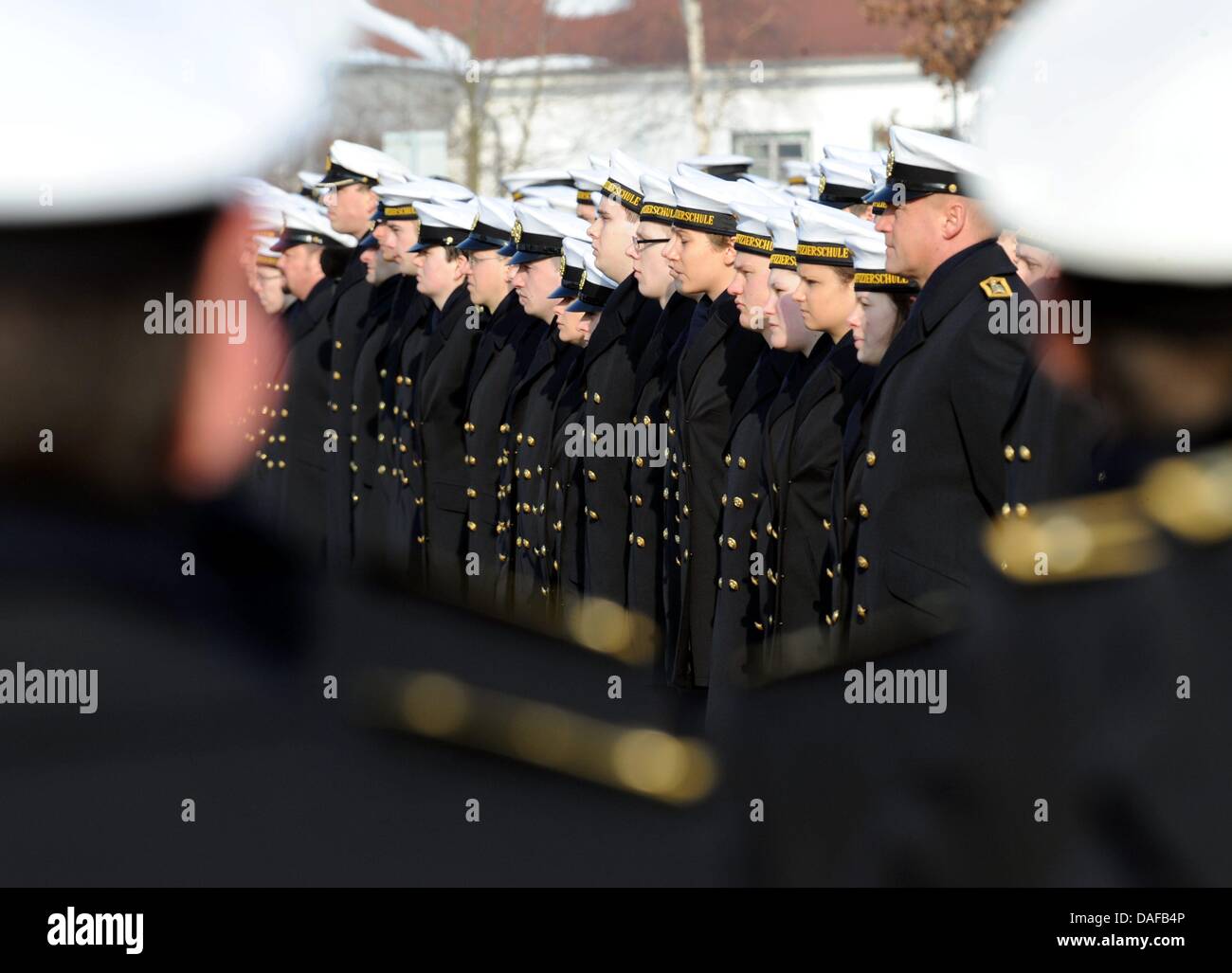 Young marines stand next to each other during a solemn pledge at the ...
