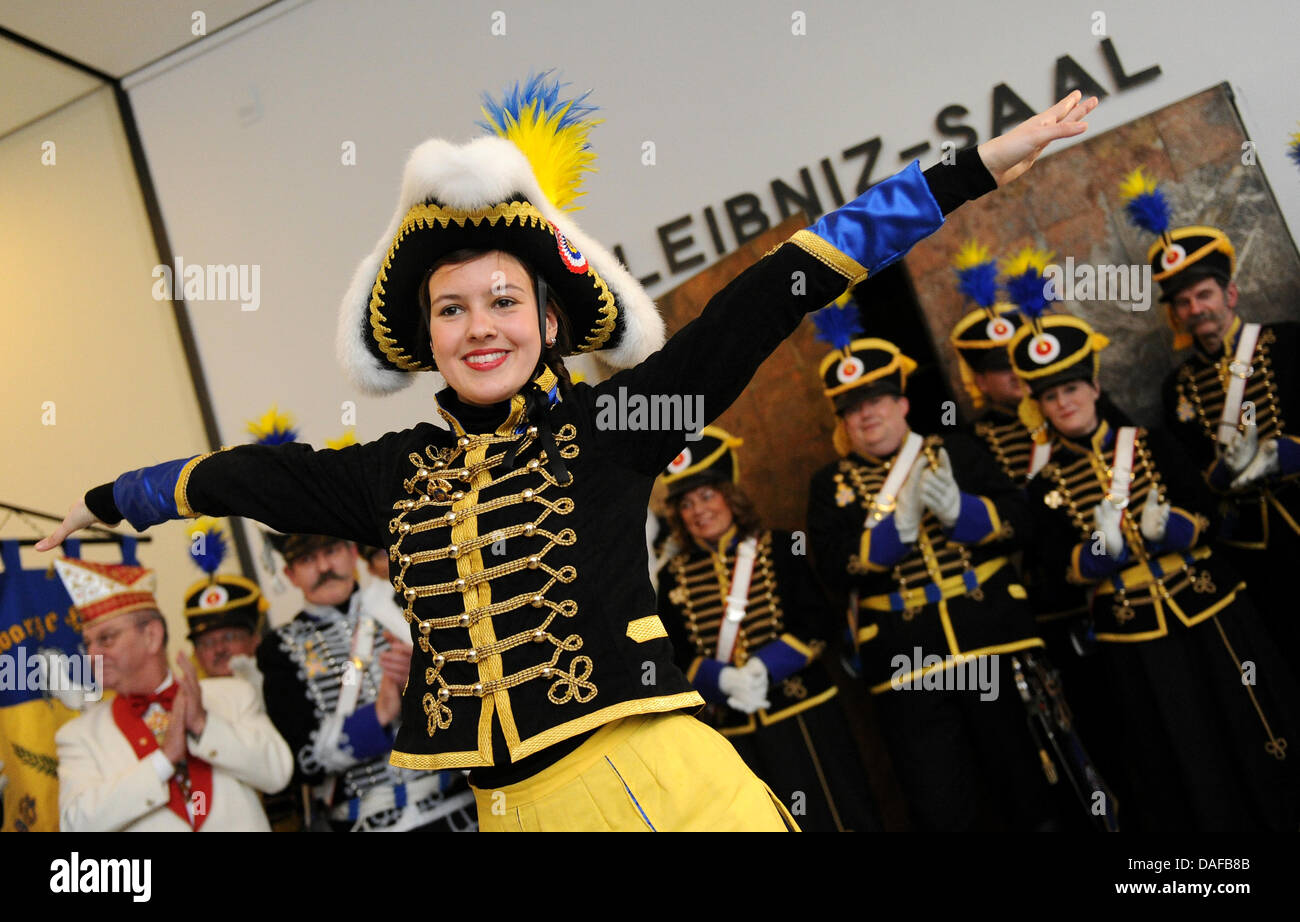 A costumed woman dances at the Lower Saxon state parliament in Hanover ...
