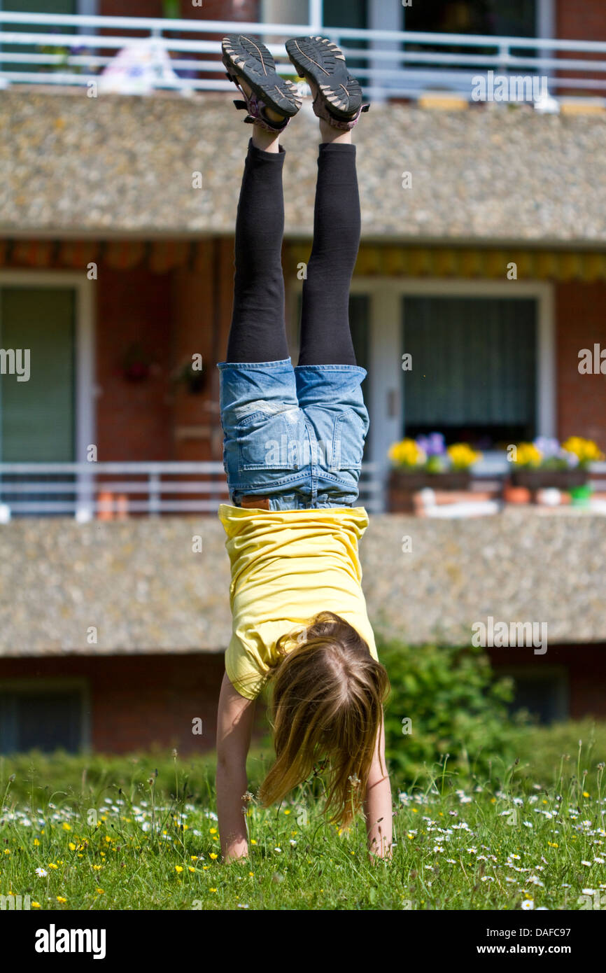 Girl doing handstand hi-res stock photography and images - Alamy