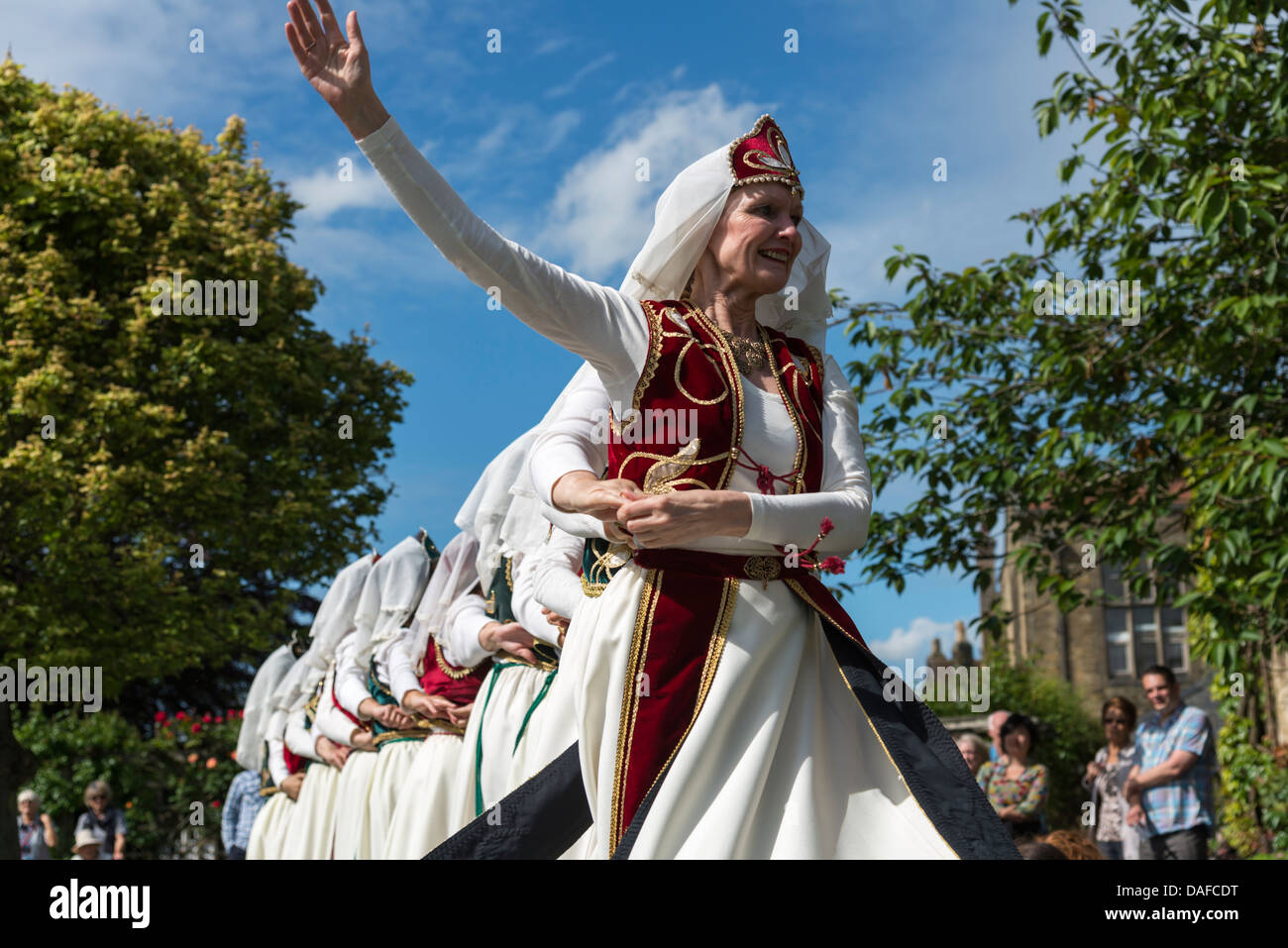Women dancers in traditional costume demonstrating Armenian dancing in ...