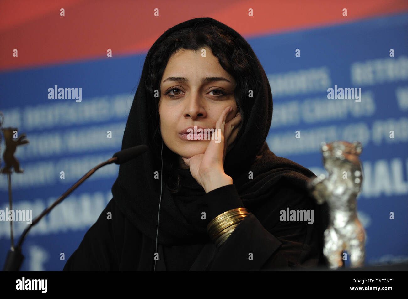 Iranian actress Sareh Bayat gestures behind the Award for Best Actress ...