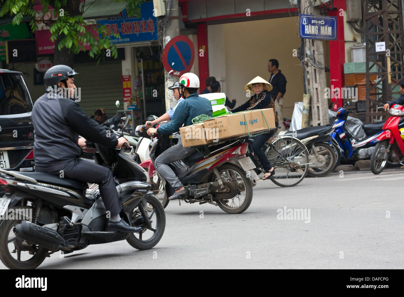 Scooter Drivers in Hanoi, Vietnam Stock Photo - Alamy