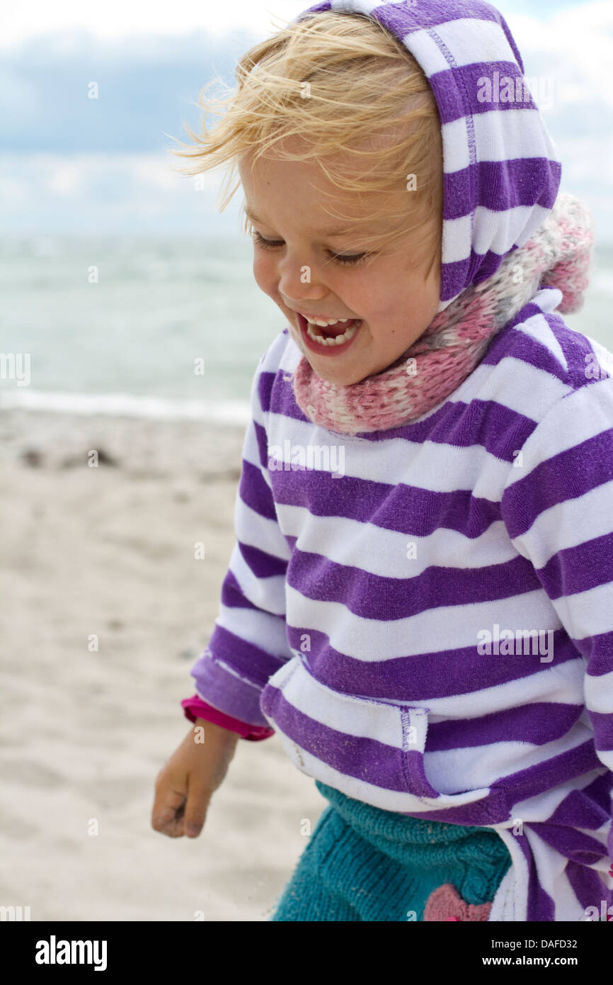 Denmark, Girl at beach, smiling Stock Photo - Alamy