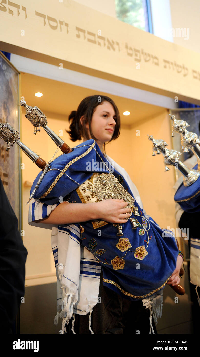 Patricia holds two thora rolls during the inauguration of the new ...