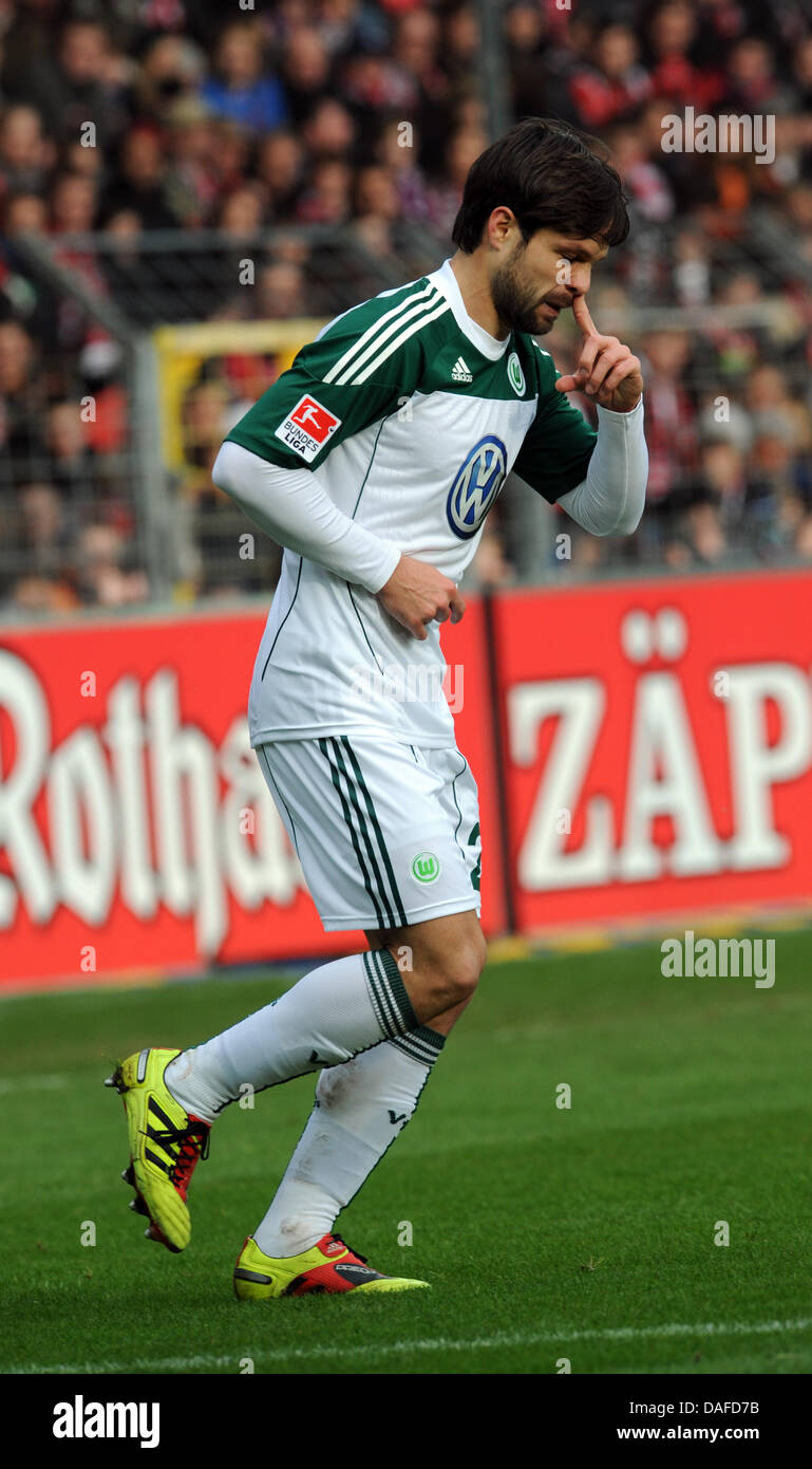 Wolfsburg's playmaker Diego blows his nose during German Bundesliga ...