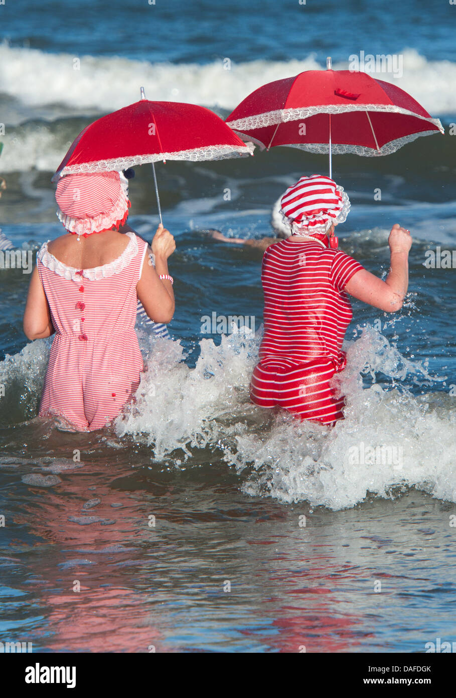 Women wearing old bathing suits take a bath at freezing temperatures in ...
