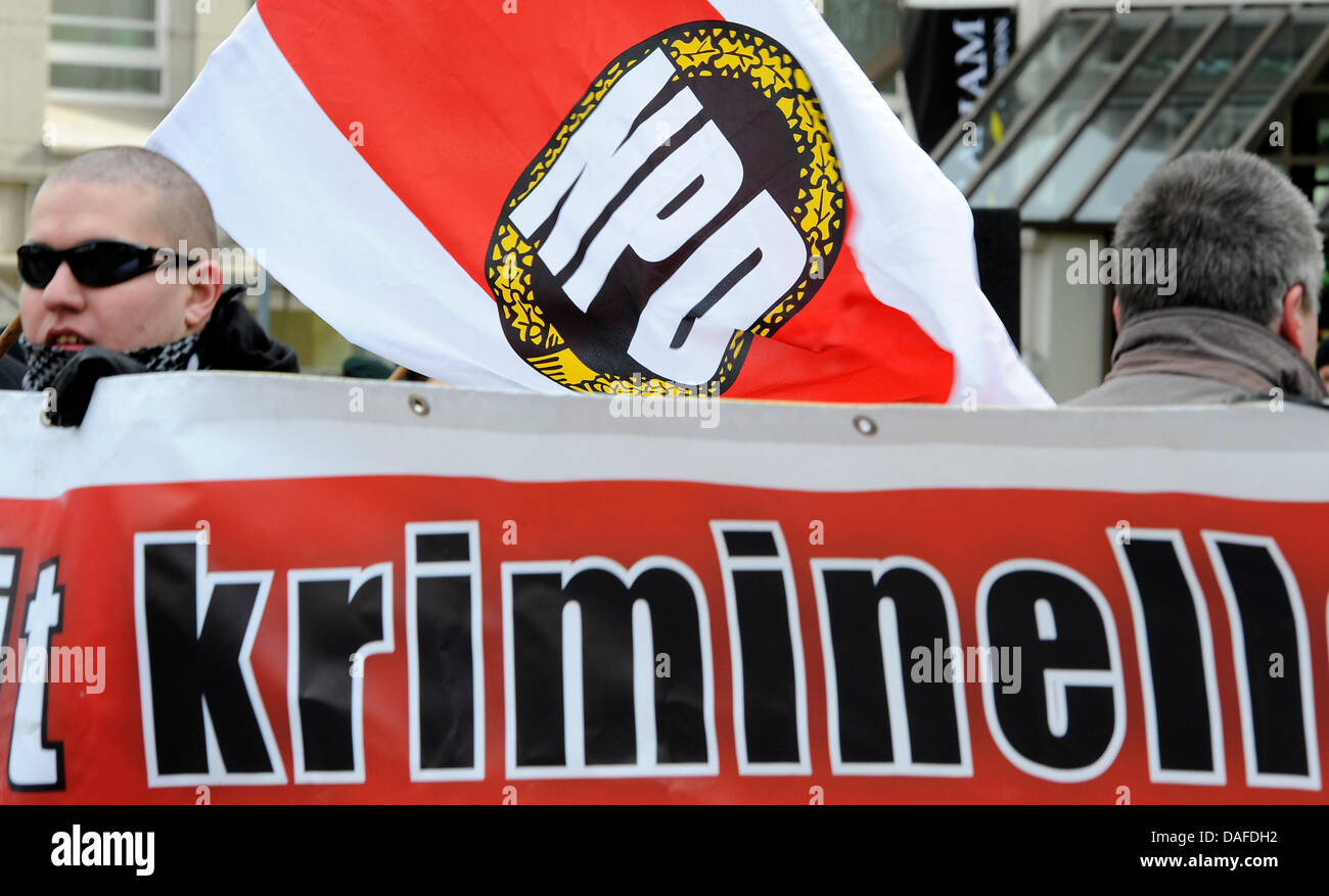 Neo-Nazis participate with a banner reading 'criminal' in a rally of ...