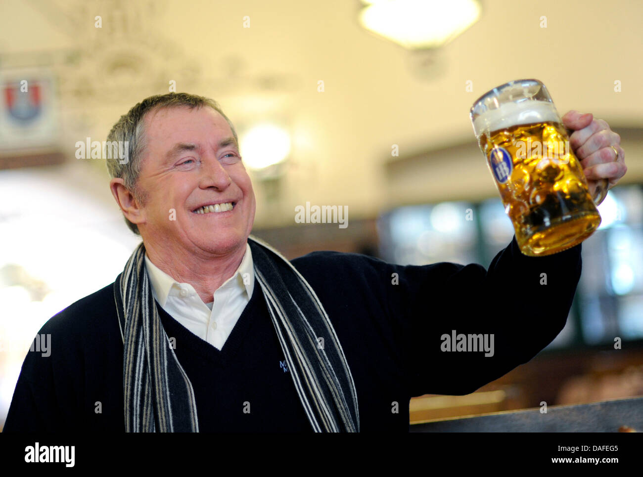 British actor John Nettles poses with a beer during a photo call in ...