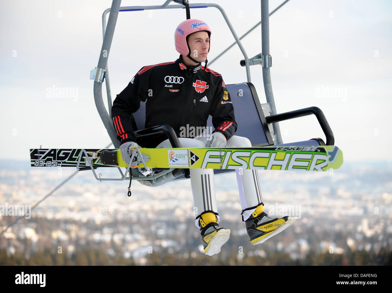 Michael Neumayer of Germany sits in a chair lift during the Men's ...