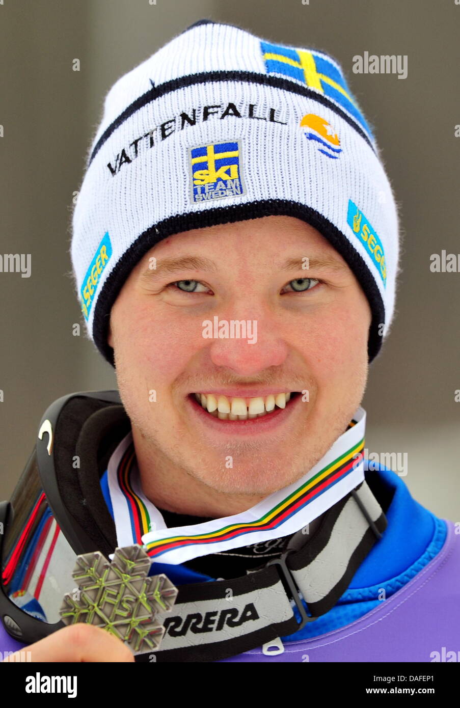 Jens Byggmark of Sweden shows the silver medal he won in the men's ...