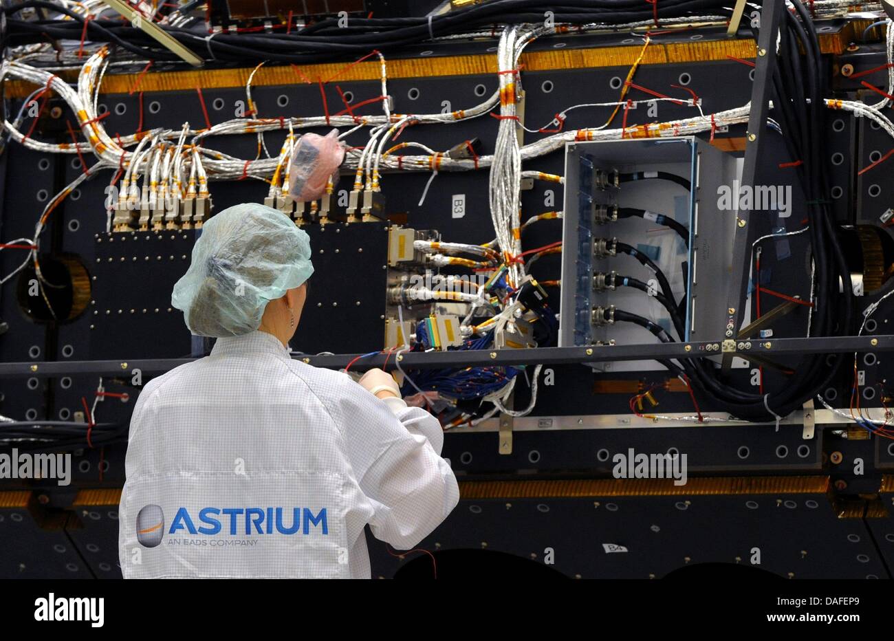 An employee of Astrium works on the satellite PAZ at a cleanroom of the ...