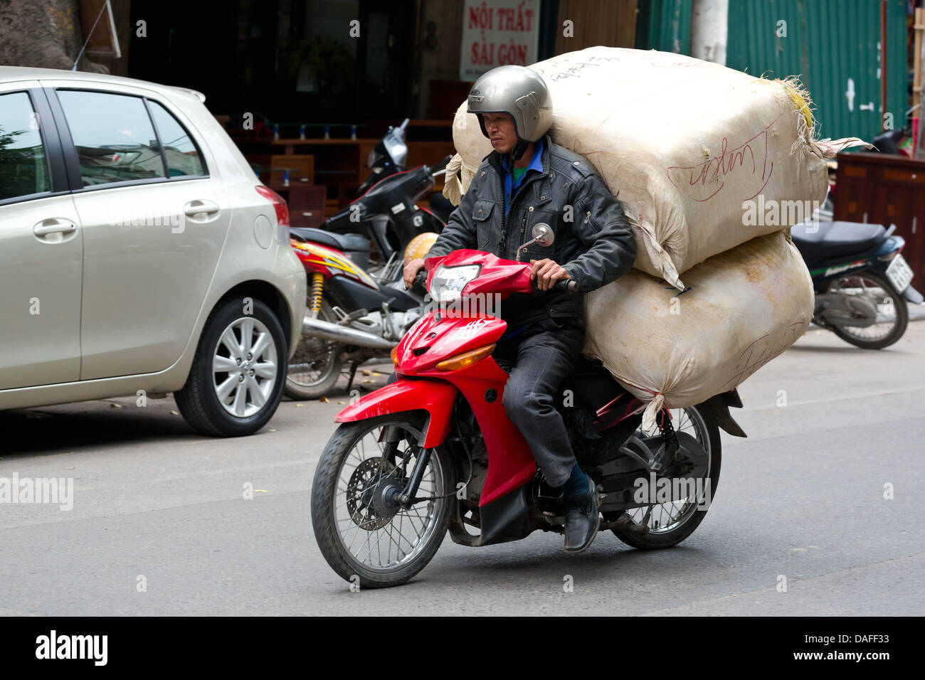 Scooter Drivers in Hanoi, Vietnam Stock Photo - Alamy