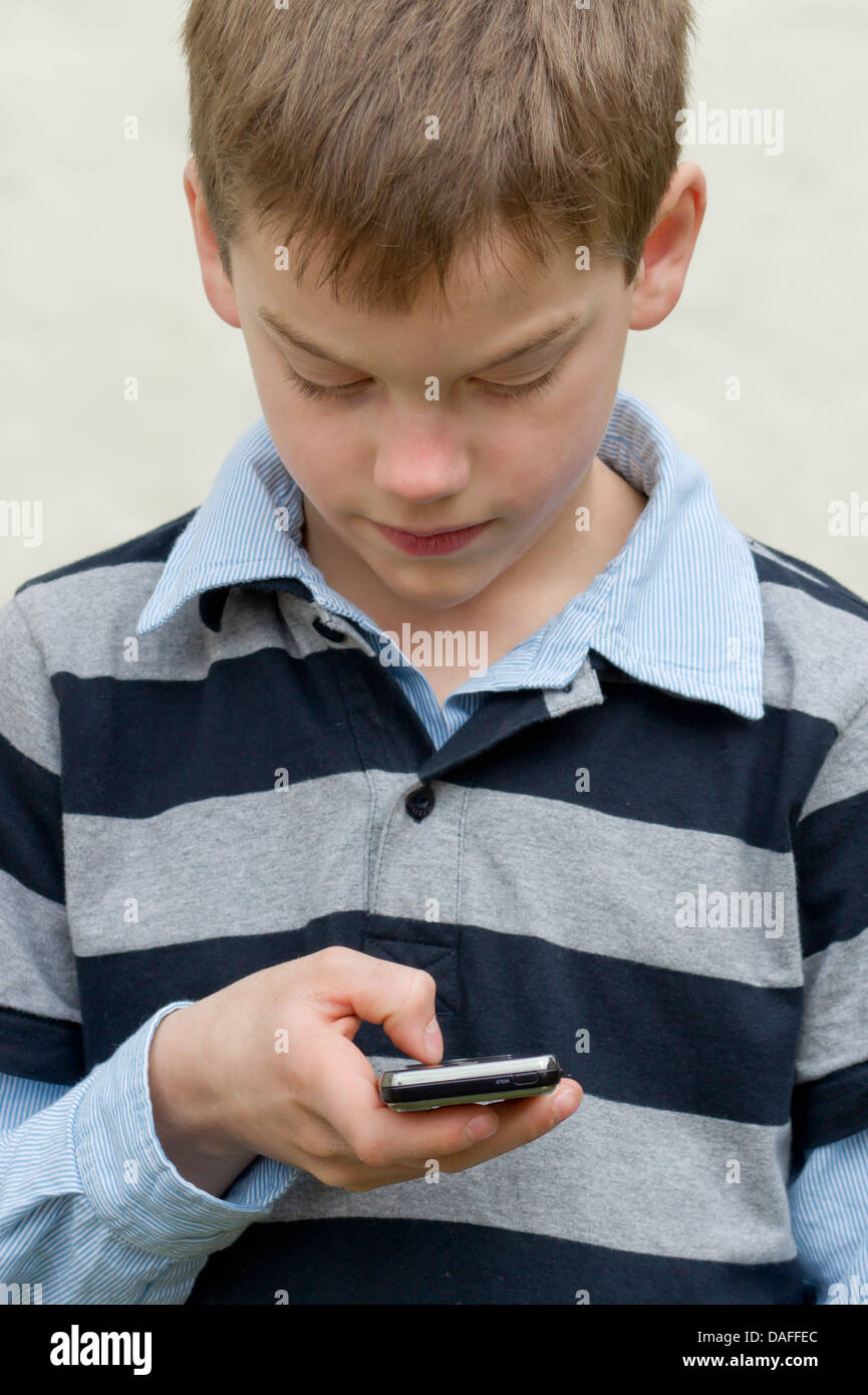 Boy using mobile phone,close up Stock Photo - Alamy