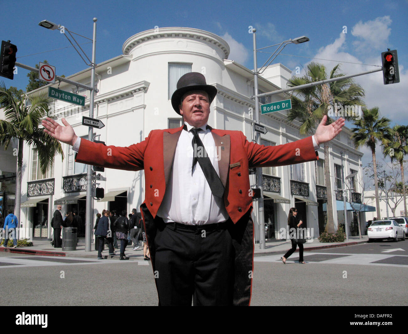 Gregg Donovan poses with black top hat and red tailcoat on Rodeo Drive ...
