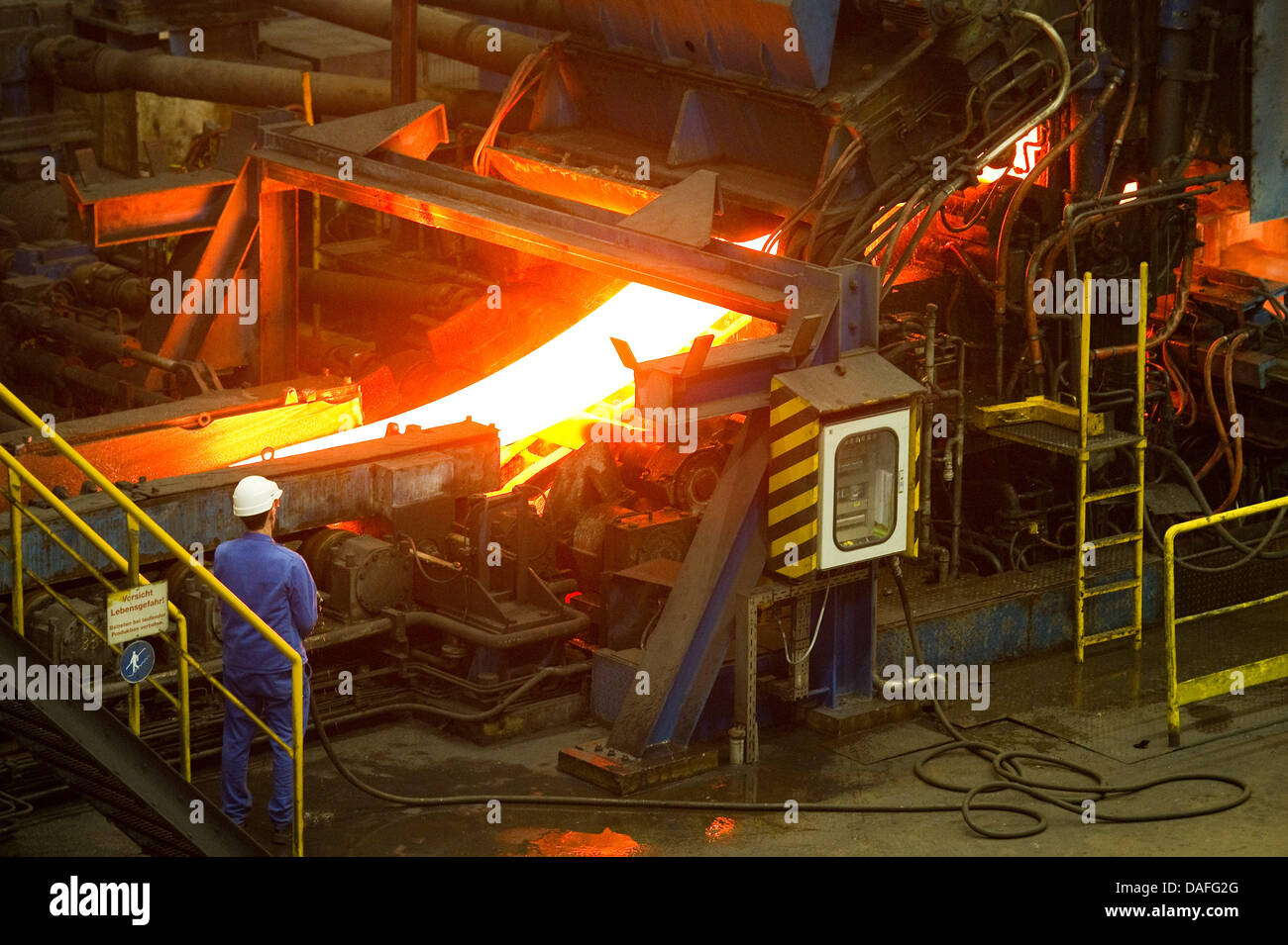 Steel rolls glow in the fire at the ArcelorMittal galvanising plant in ...