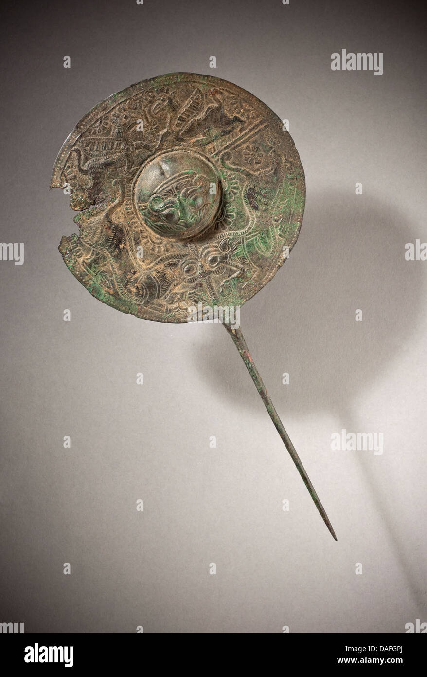 This disc-headed pin is an example of ancient jewelry design ...
