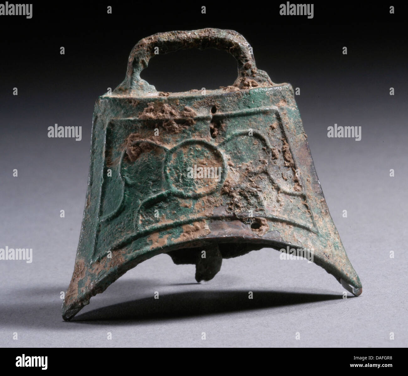 This dog jingle with a mask, crafted from bronze, is a unique ...