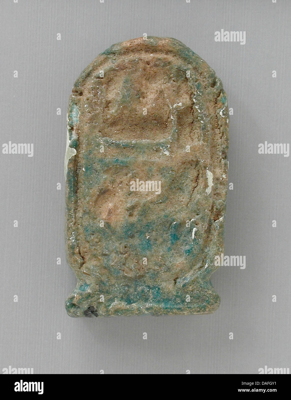 This double-sided faience amulet features an illegible king’s name ...