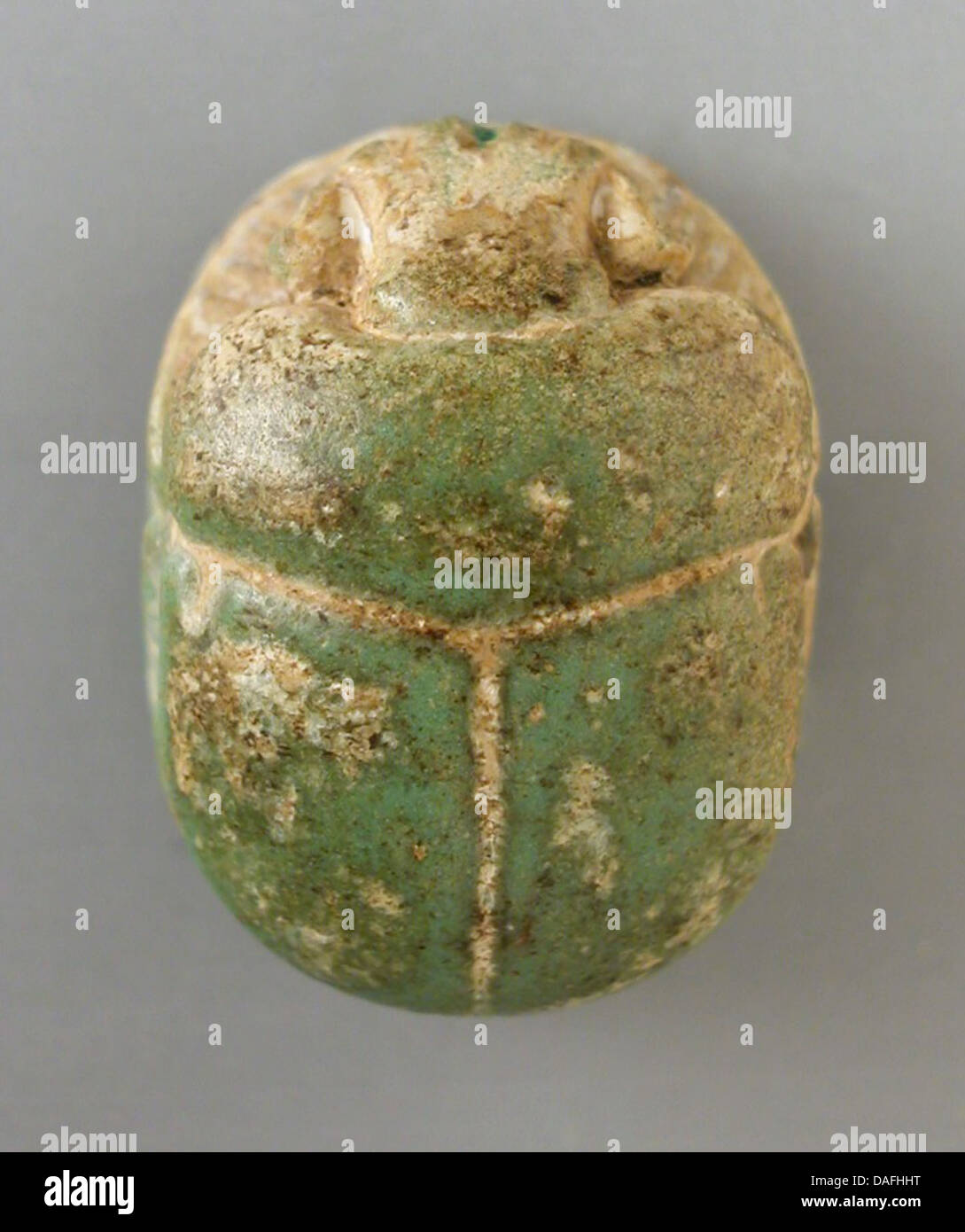 This faience scarab features an inscription symbolizing good luck, a ...