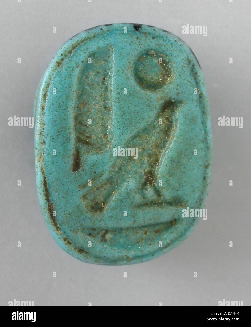 A faience scarab featuring cryptographic writing of 'Amen', part of the ...