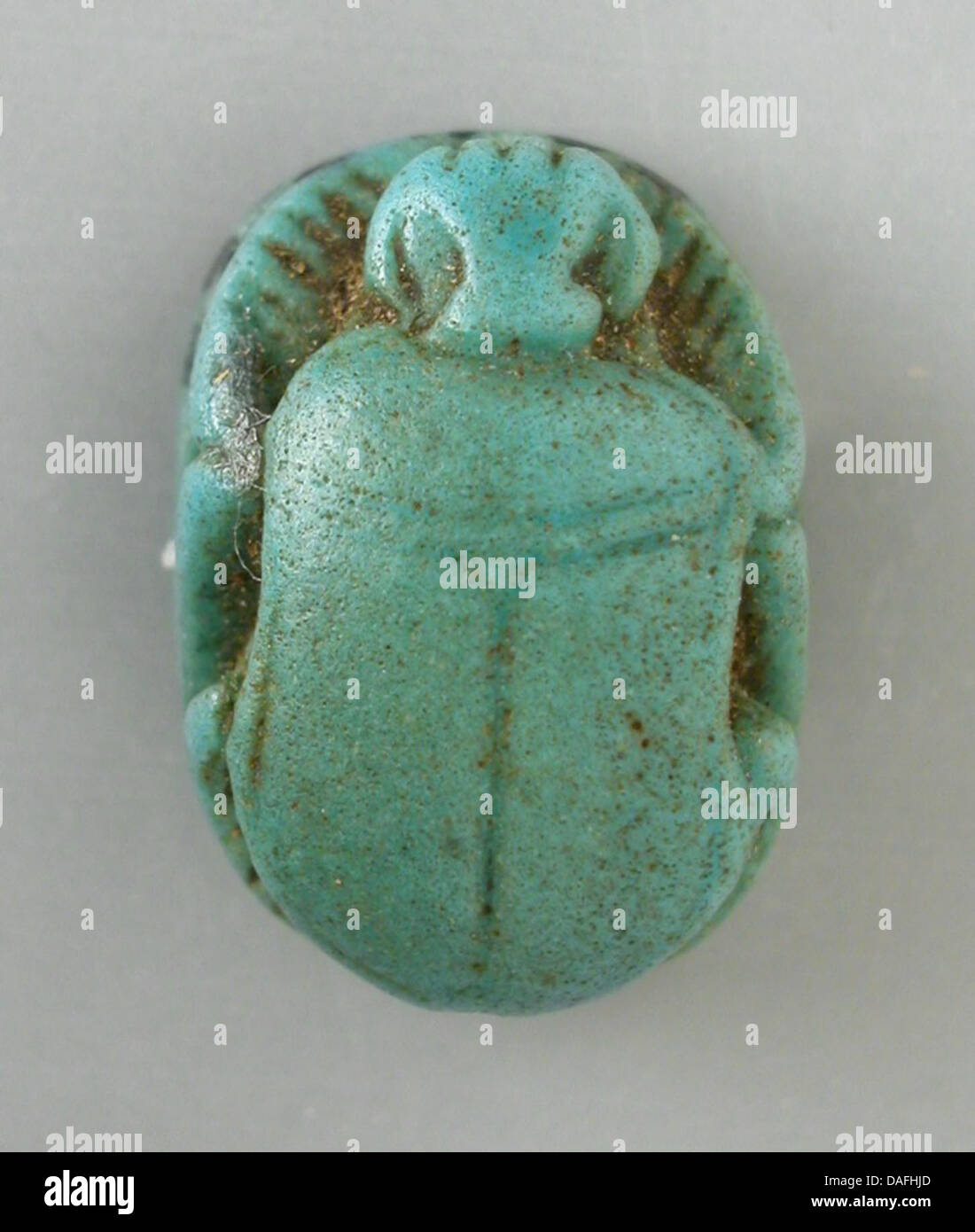 This faience scarab features cryptographic writing of 'Amen ...