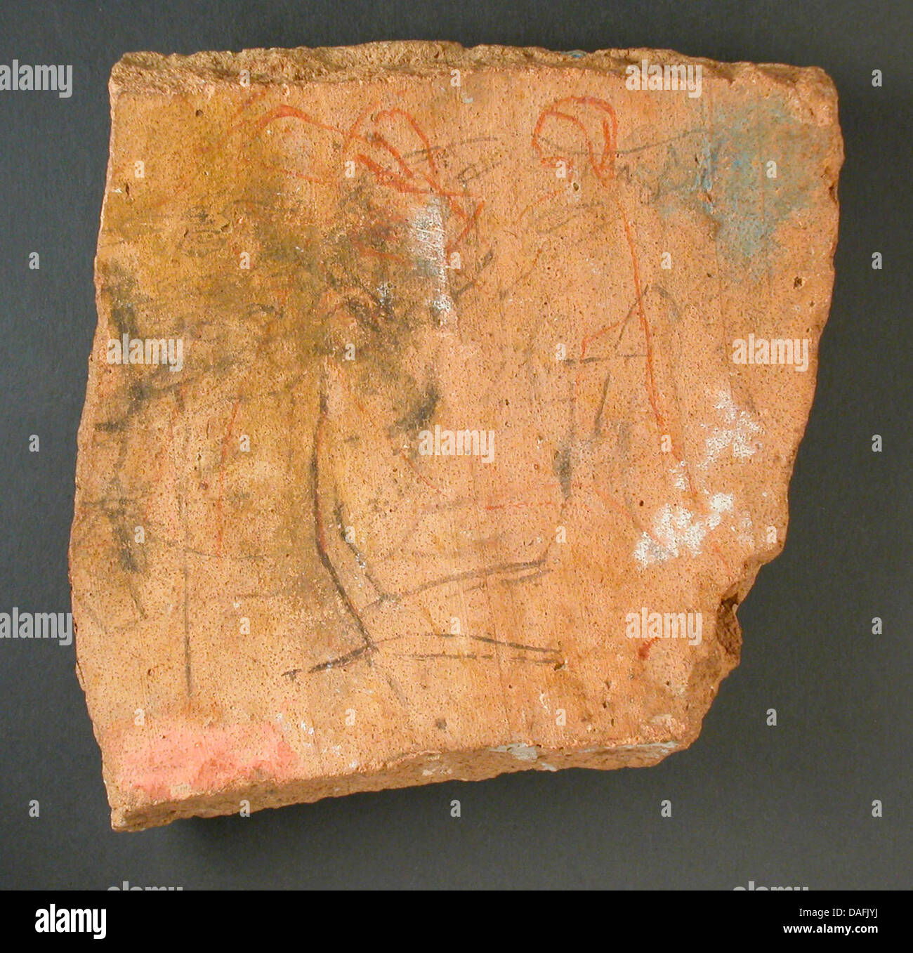 This ostracon features a depiction of a male profile, highlighting ...