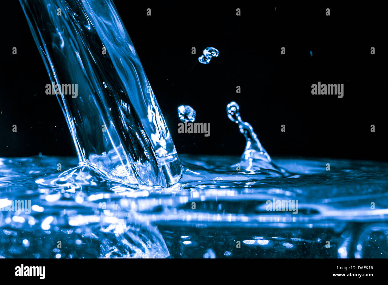 A beautiful shape created by the fluid motion of water splashing as it ...