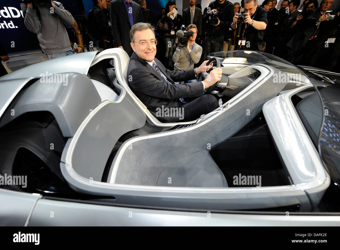 BMW CEO Norbert Reithofer poses with the German carmaker's study BMW ...