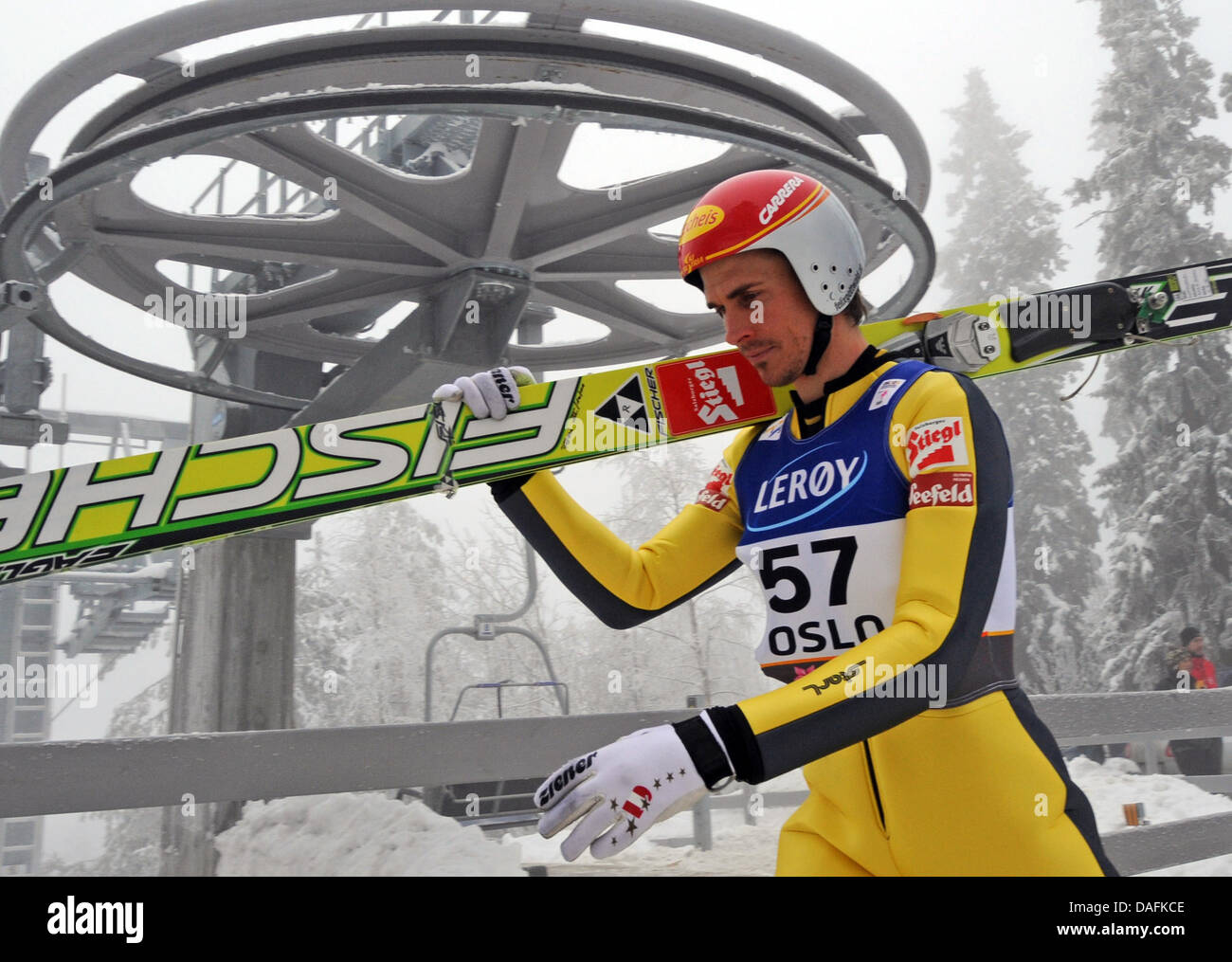 Felix Gottwald from Austria carries his skies during the Ski Jumping ...
