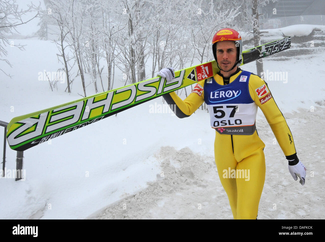 Felix Gottwald from Austria carries his skis during the Ski Jumping ...