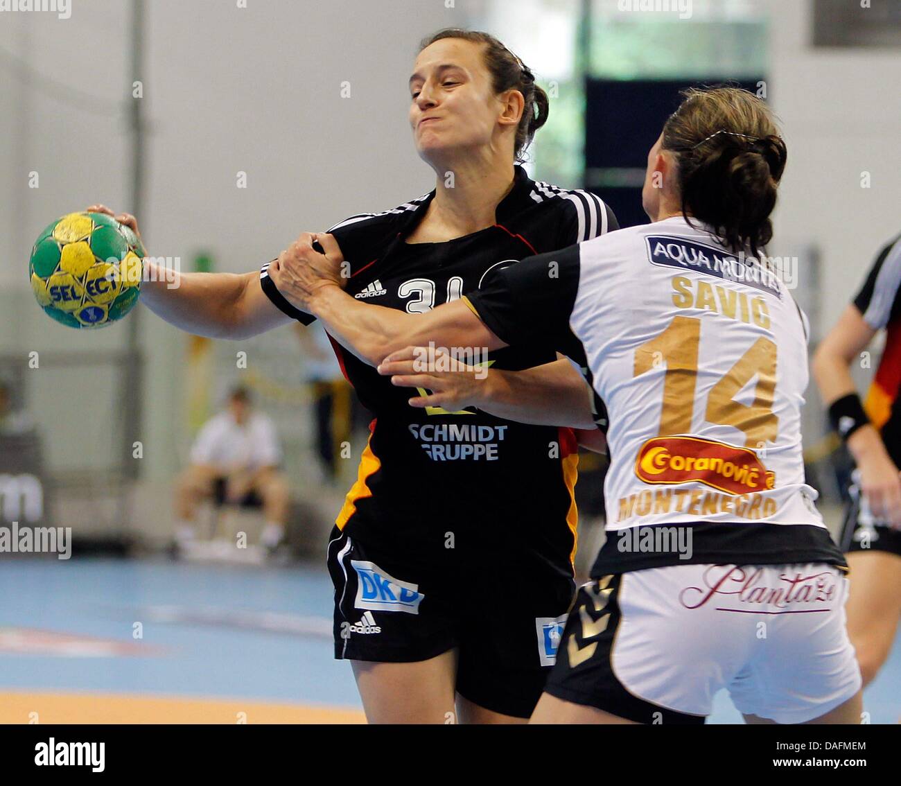 Germany's Kerstin Wohlbold (L) and Montenegro's Maja Savic vie for the ...