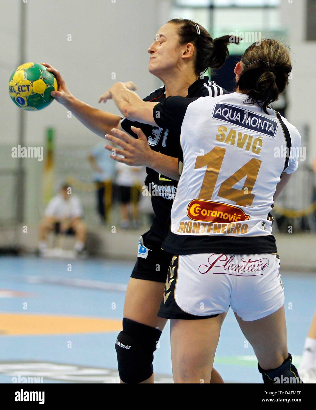 Germany's Kerstin Wohlbold (L) and Montenegro's Maja Savic vie for the ...