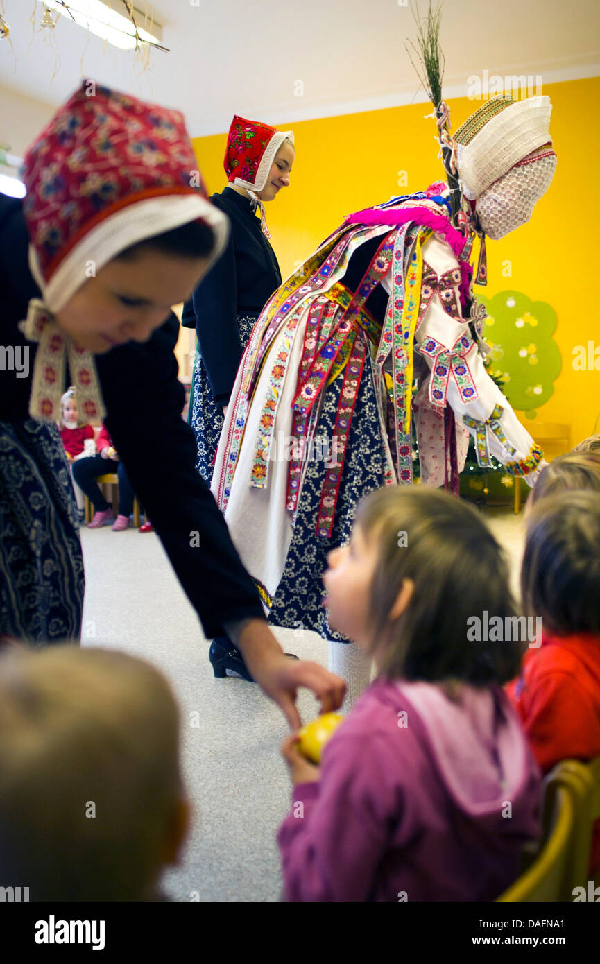 The traditionally dressed Sorbian Christkind with veiled face and ...