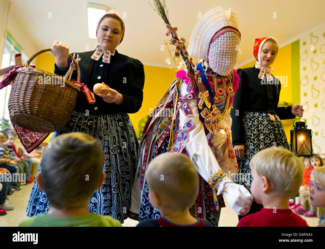 The traditionally dressed Sorbian Christkind with veiled face and ...