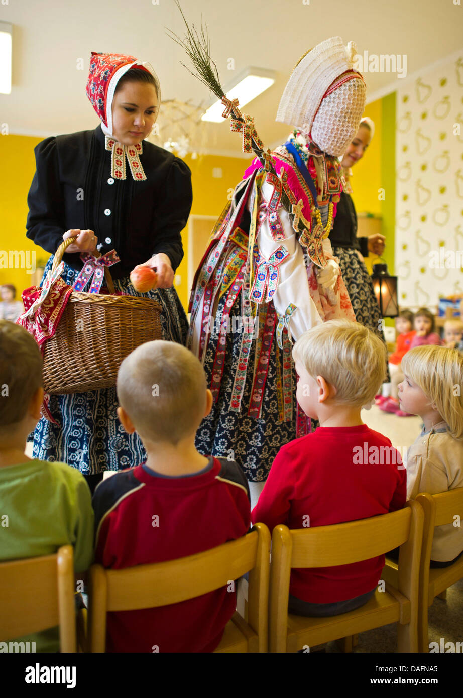The traditionally dressed Sorbian Christkind with veiled face and ...