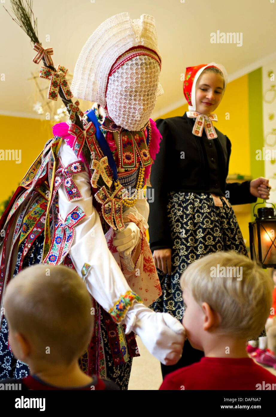 The traditionally dressed Sorbian Christkind with veiled face and ...