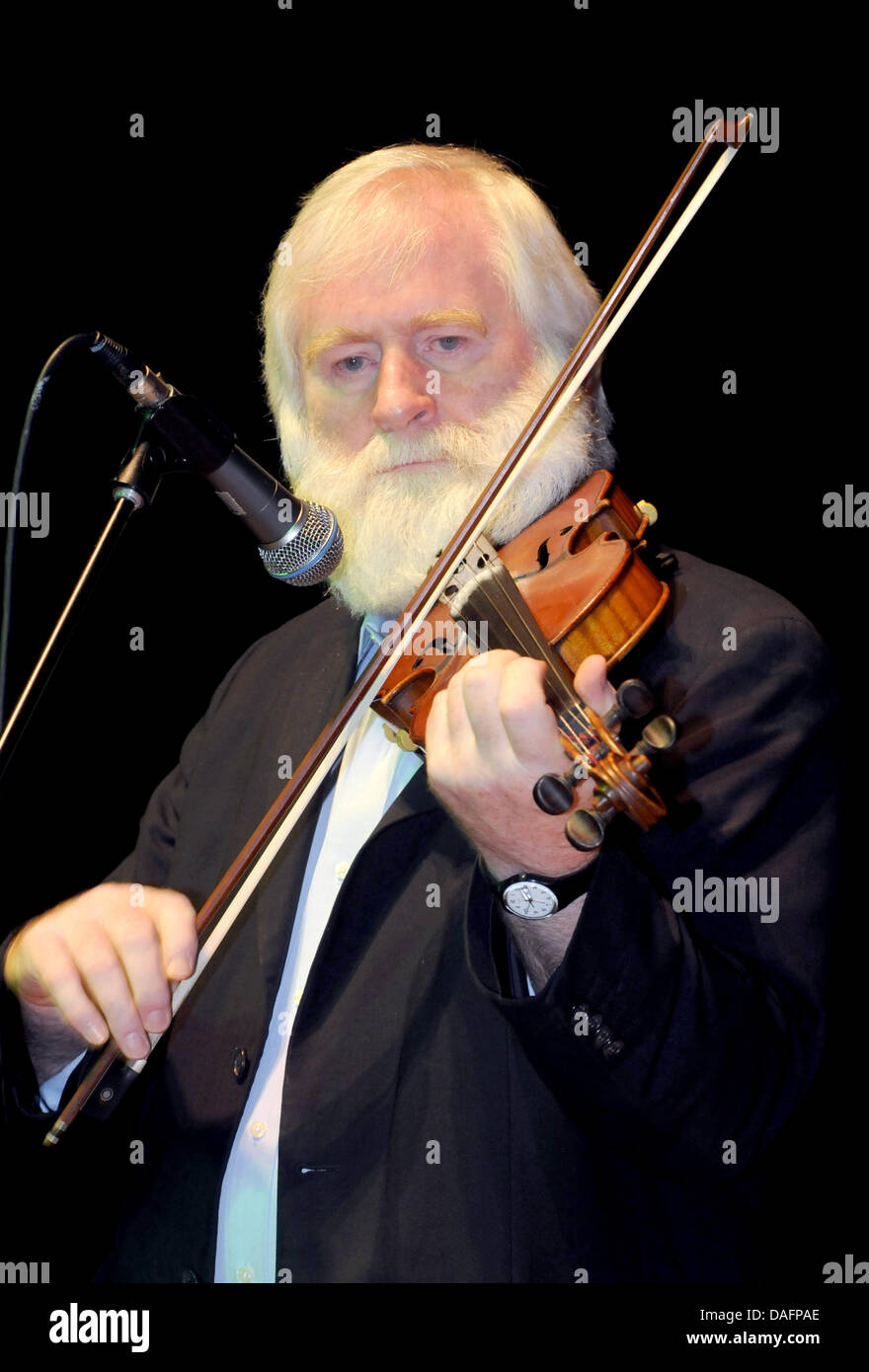 Member of the Irish folk band 'The Dubliners', John Sheahan, performs ...