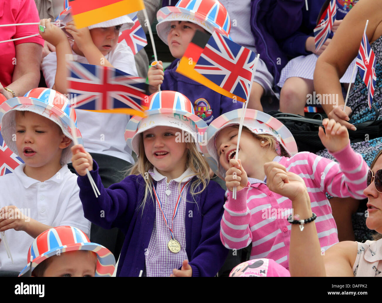 School children wave flags hi-res stock photography and images - Alamy