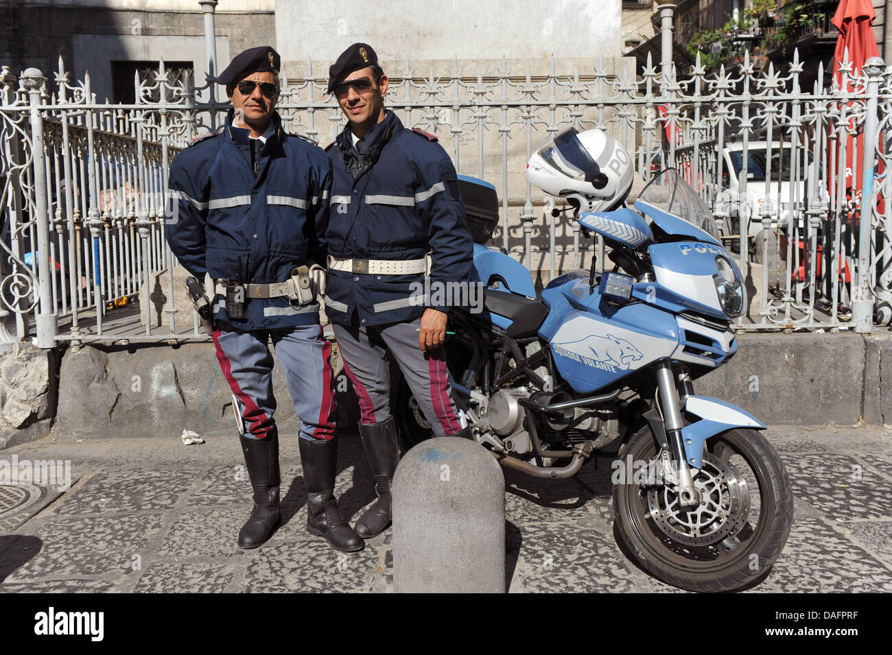 Police officers patrol through the narrow streets and alleyways in ...