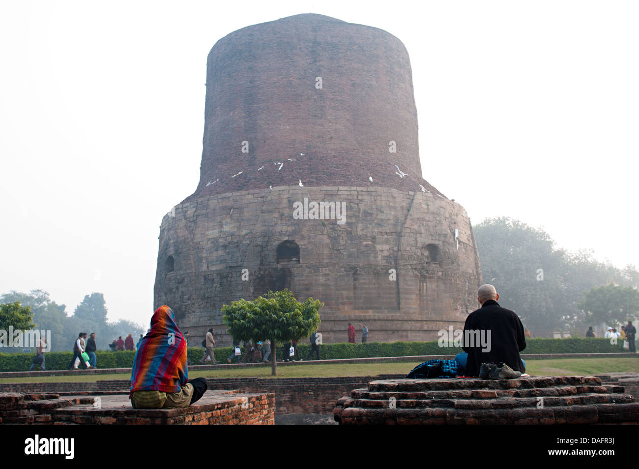 Pilgrims praying in Dhamekh stupa complex. Sarnath, Uttar Pradesh ...