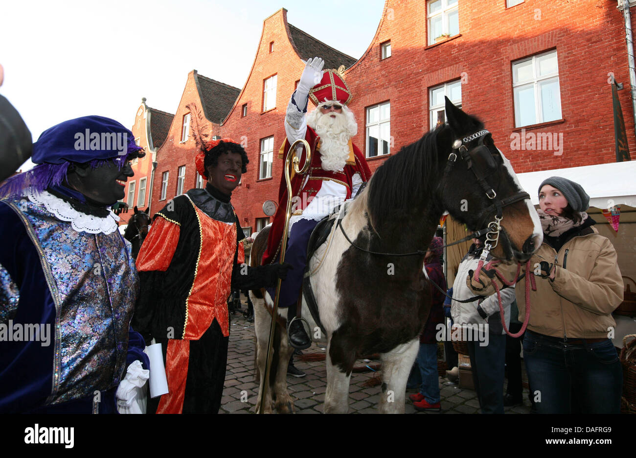 The Dutch Santa Claus called 'Sinterklaas' and the black Moor walk by ...