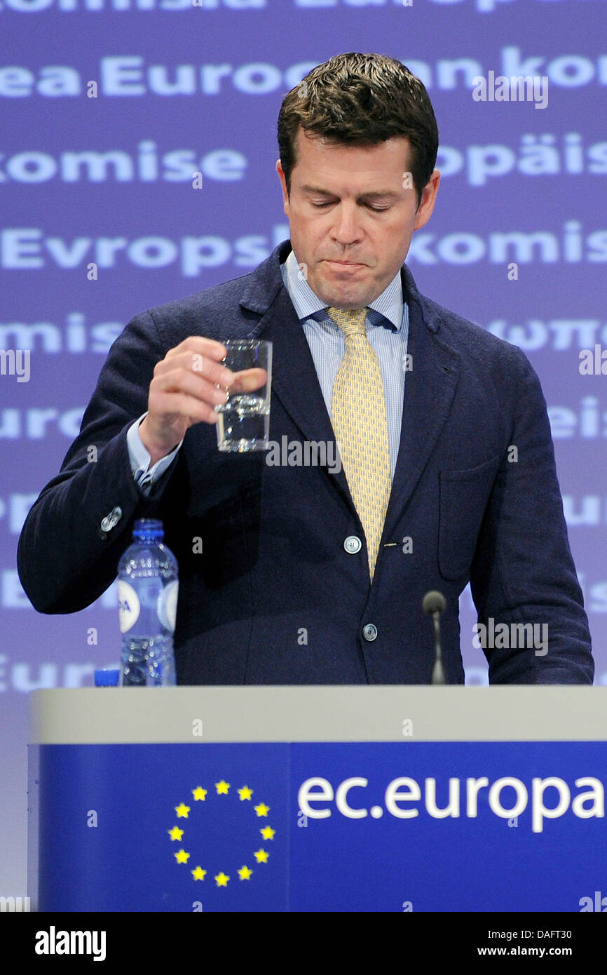Former Defence Minister Karl-Theodor zu Guttenberg drinks during a ...