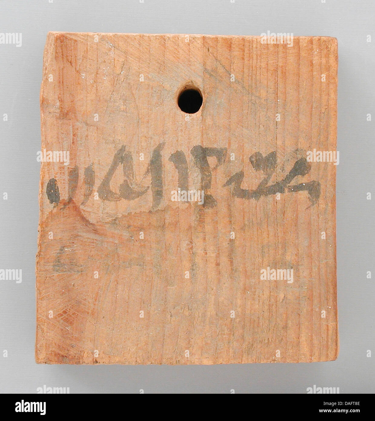 This label is inscribed with a hieratic script, a cursive form of ...